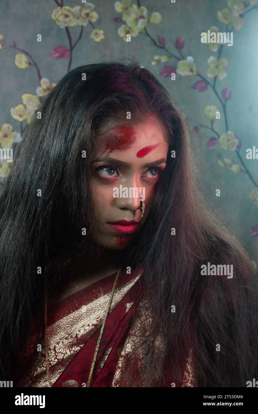 Beautiful young woman suffer head and face trauma in dramatic light ...