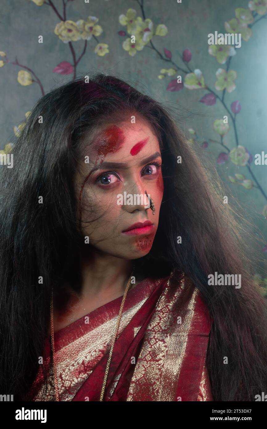 Beautiful young woman suffer head and face trauma in dramatic light ...