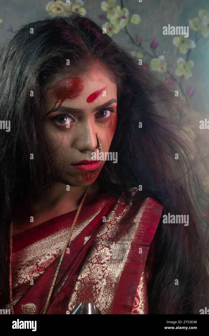 Beautiful young woman suffer head and face trauma in dramatic light ...