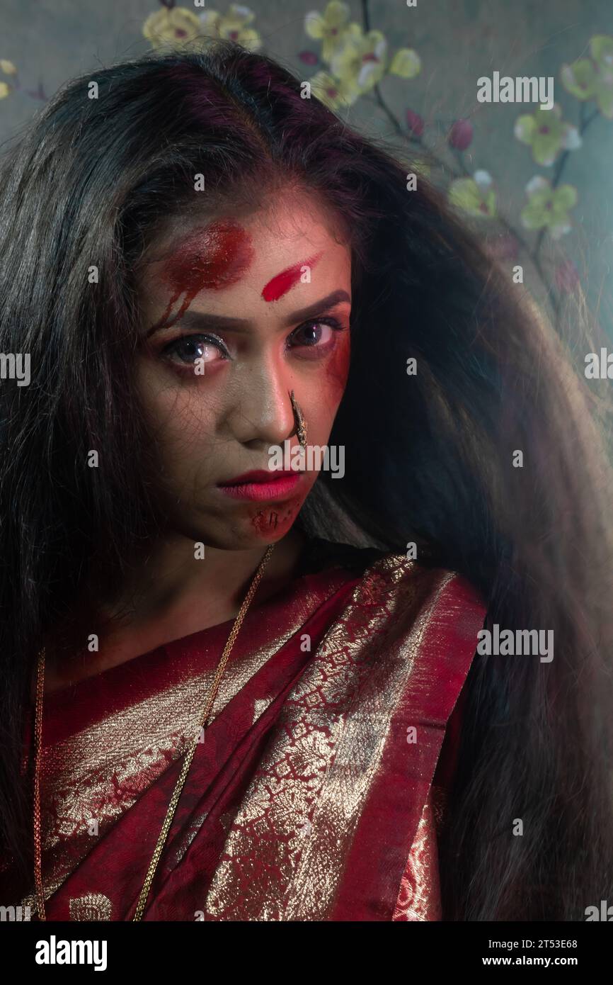 Beautiful young woman suffer head and face trauma in dramatic light ...