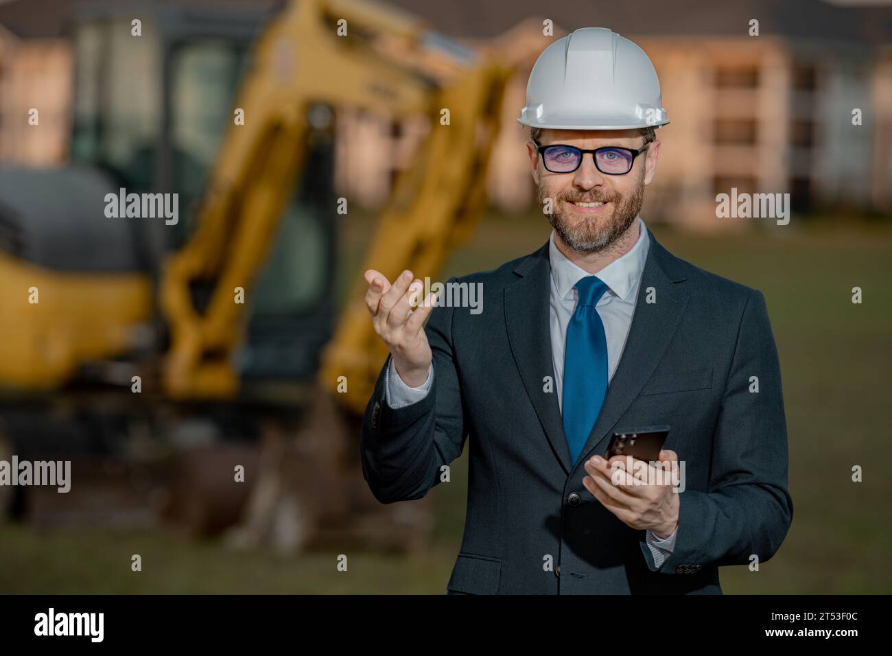 Successful construction business owner. Construction worker in suit and ...
