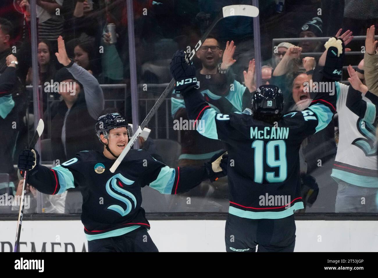 Seattle Kraken right wing Eeli Tolvanen, left, comes over to celebrate ...