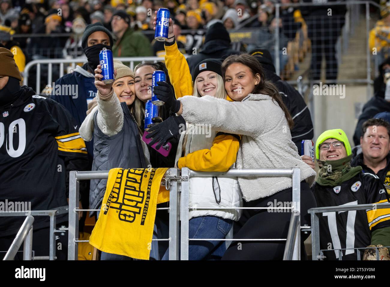 Pittsburgh Steelers fans are shown with cans of Bud Light during an NFL ...