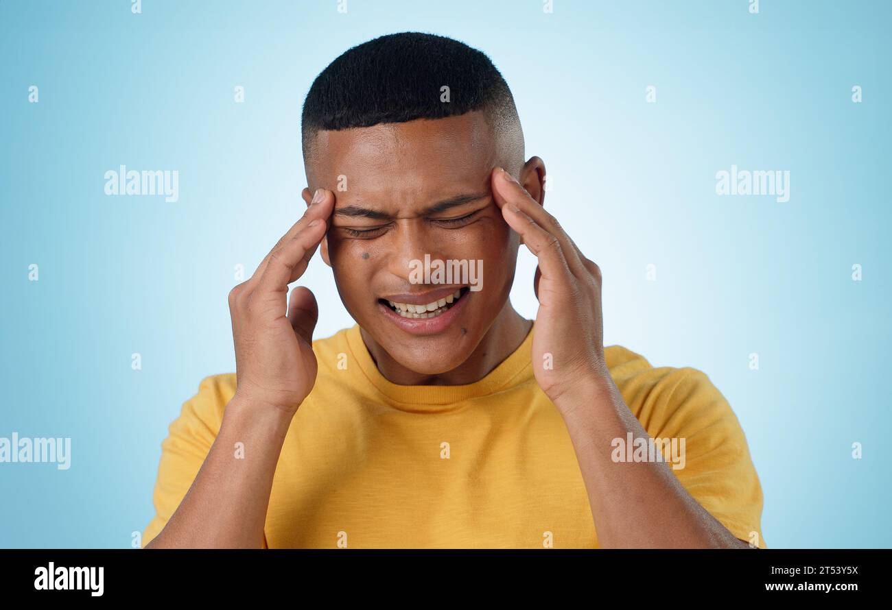 Headache, stress and man in studio with anxiety, burnout or frustrated ...