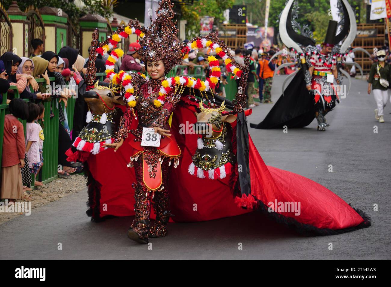 The participant Biro Fashion Carnival with a cow costume Stock Photo ...