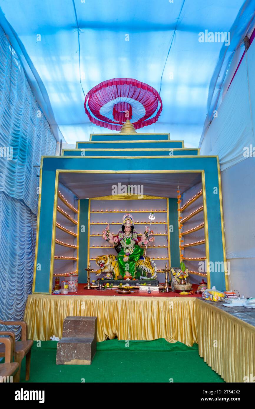 A beautiful idol of Maa Durga being worshipped at a pandal during ...