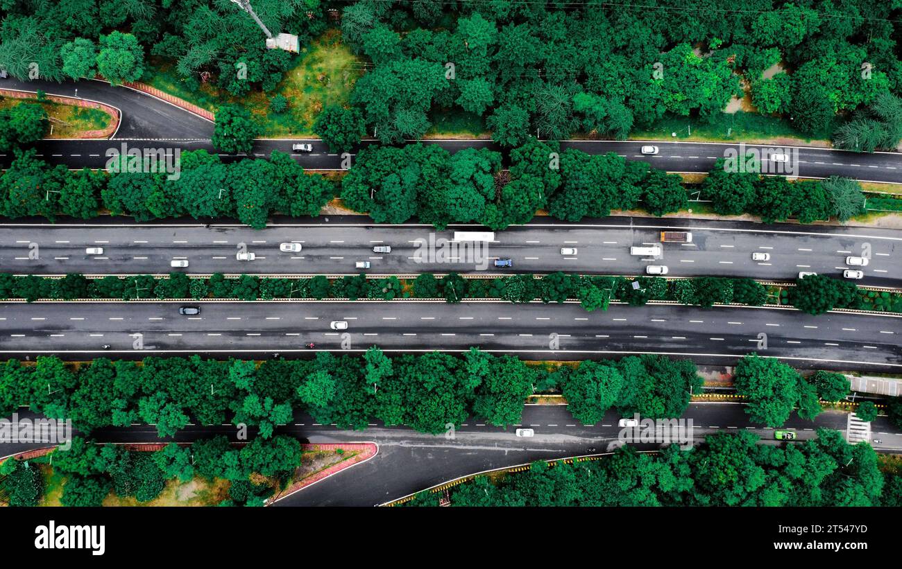An aerial view of highways and freeways leading to cities, seen from a ...