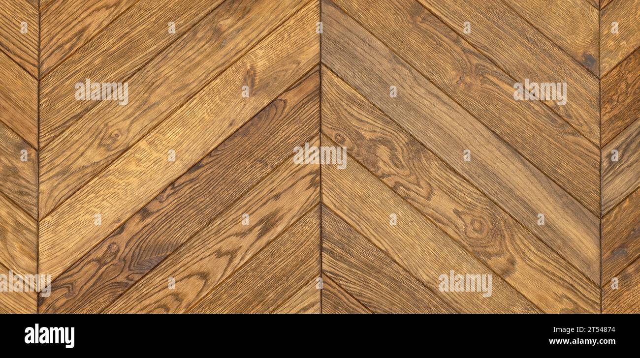 A beautiful dark oak parquet flooring pattern in a herringbone shape ...