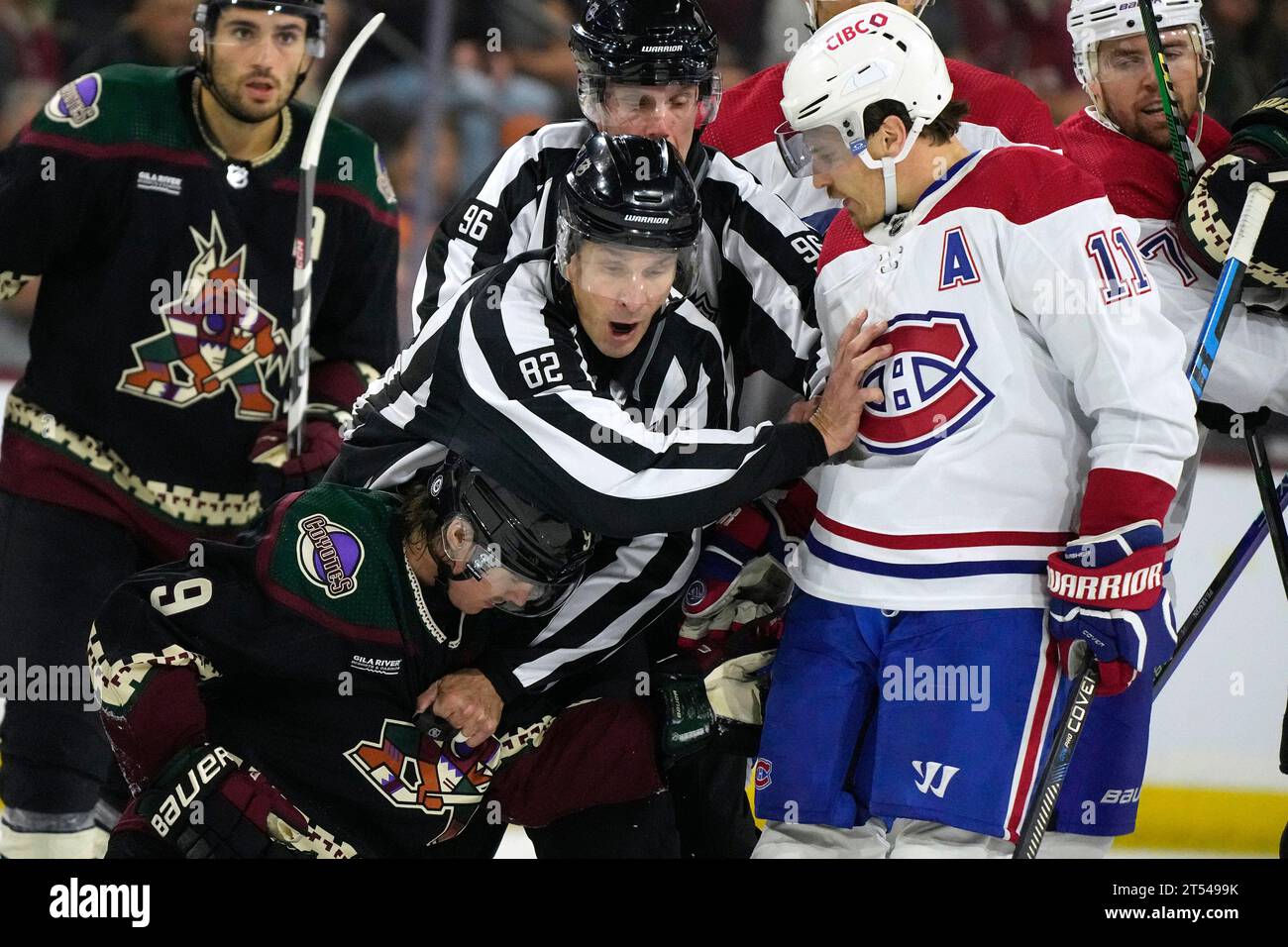 Linesman Ryan Galloway (82) separates Arizona Coyotes right wing ...