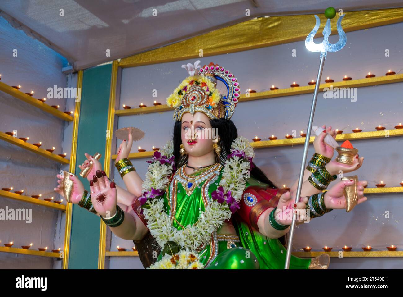 A beautiful idol of Maa Durga being worshipped at a pandal during ...