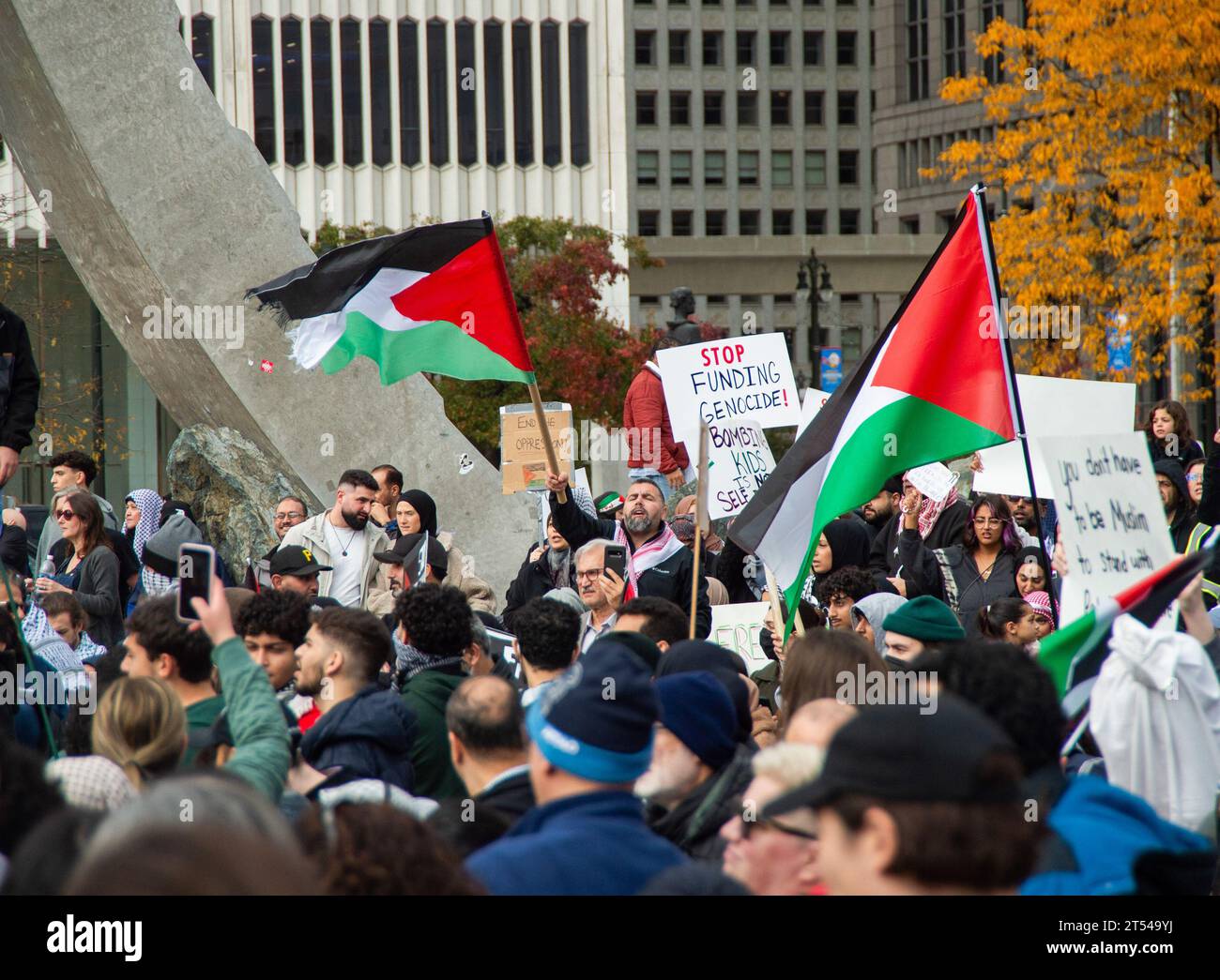 Detroit, Michigan, USA. 28th Oct, 2023. Protesters hold flags and ...