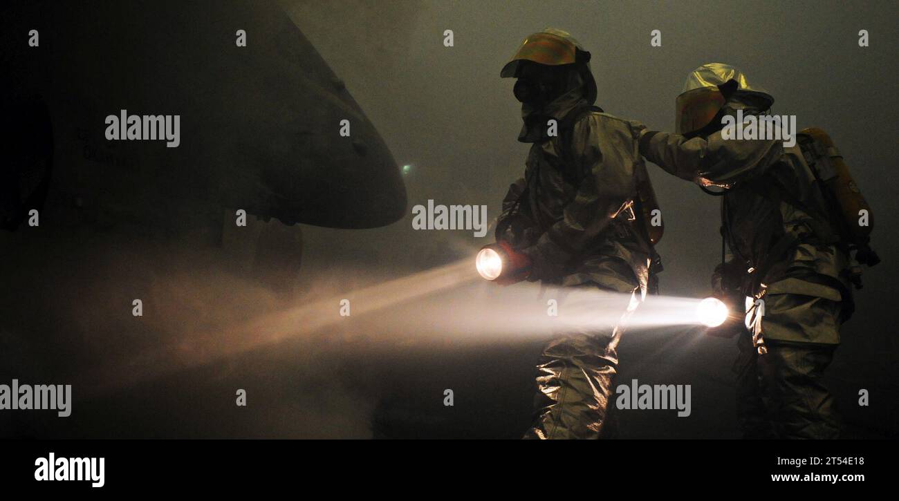 Crash, salvage fire fighters, USS Harry S. Truman (CVN 75 Stock Photo ...