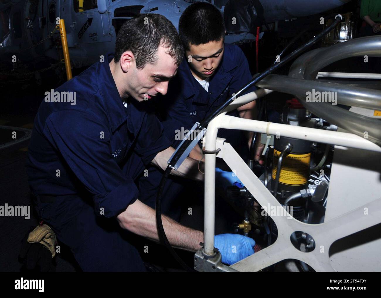 CVN 69, emergency breathing air compressor, maintenece, male, Sailor ...