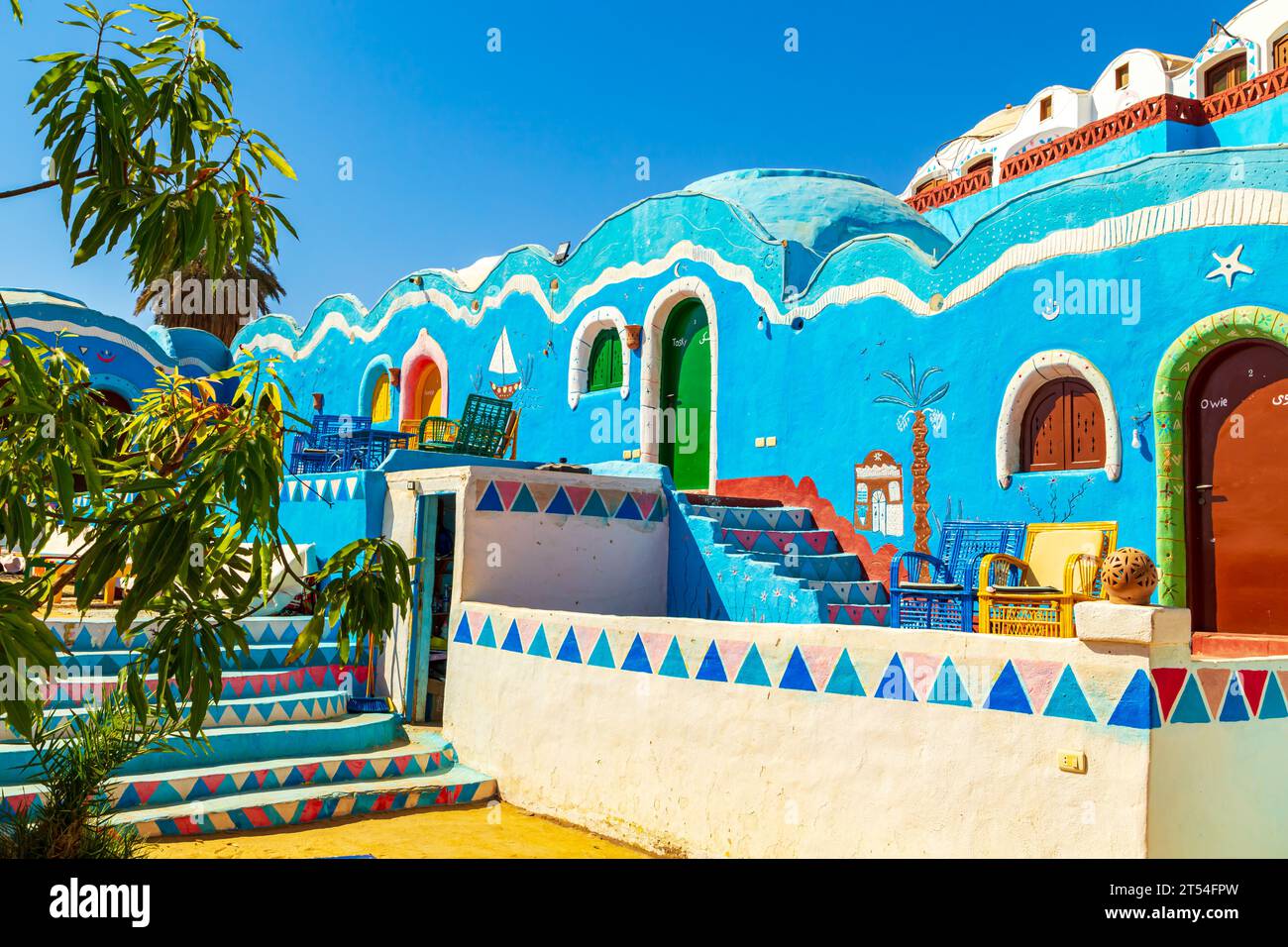 Colorful bright houses of the famous Nubian village. Aswan, Egypt ...