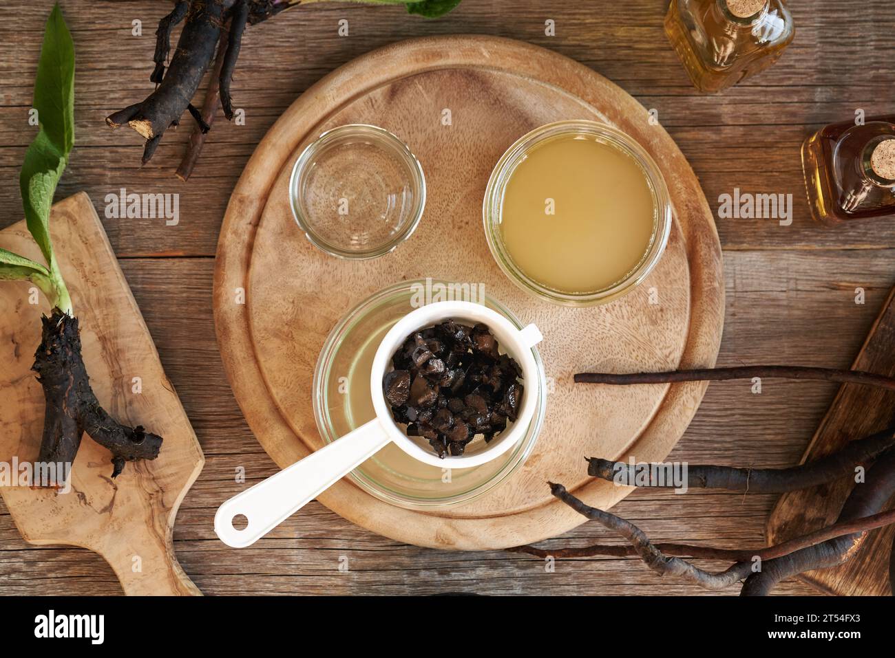 Preparation of homemade comfrey root ointment - straining through a ...