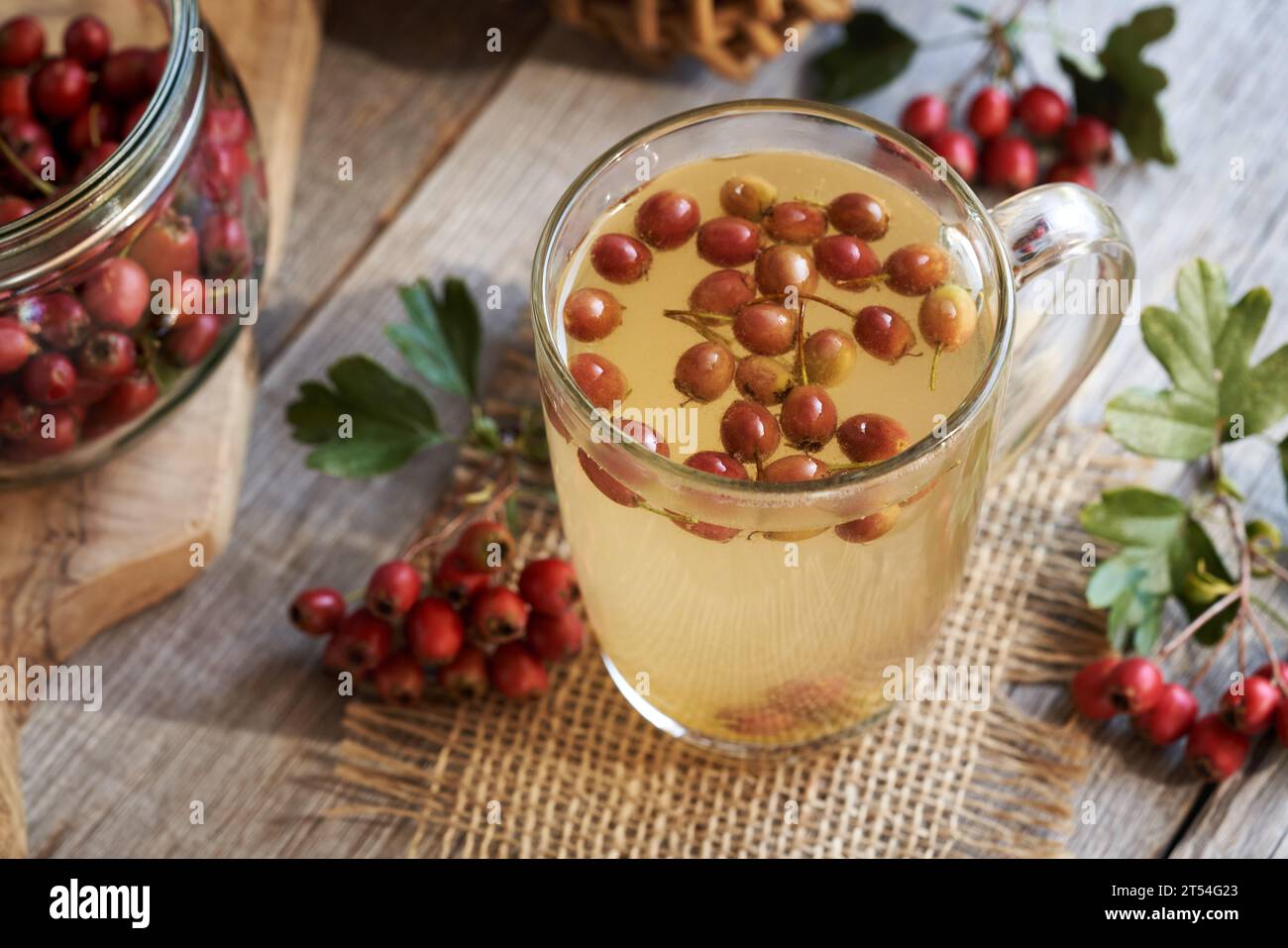 A glass cup of hawthorn berry tea Stock Photo - Alamy