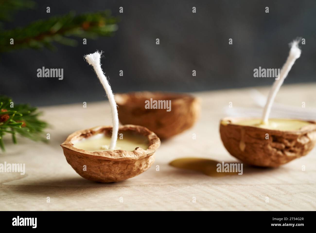Preparation from Christmas candles from beeswax and walnut shells Stock ...