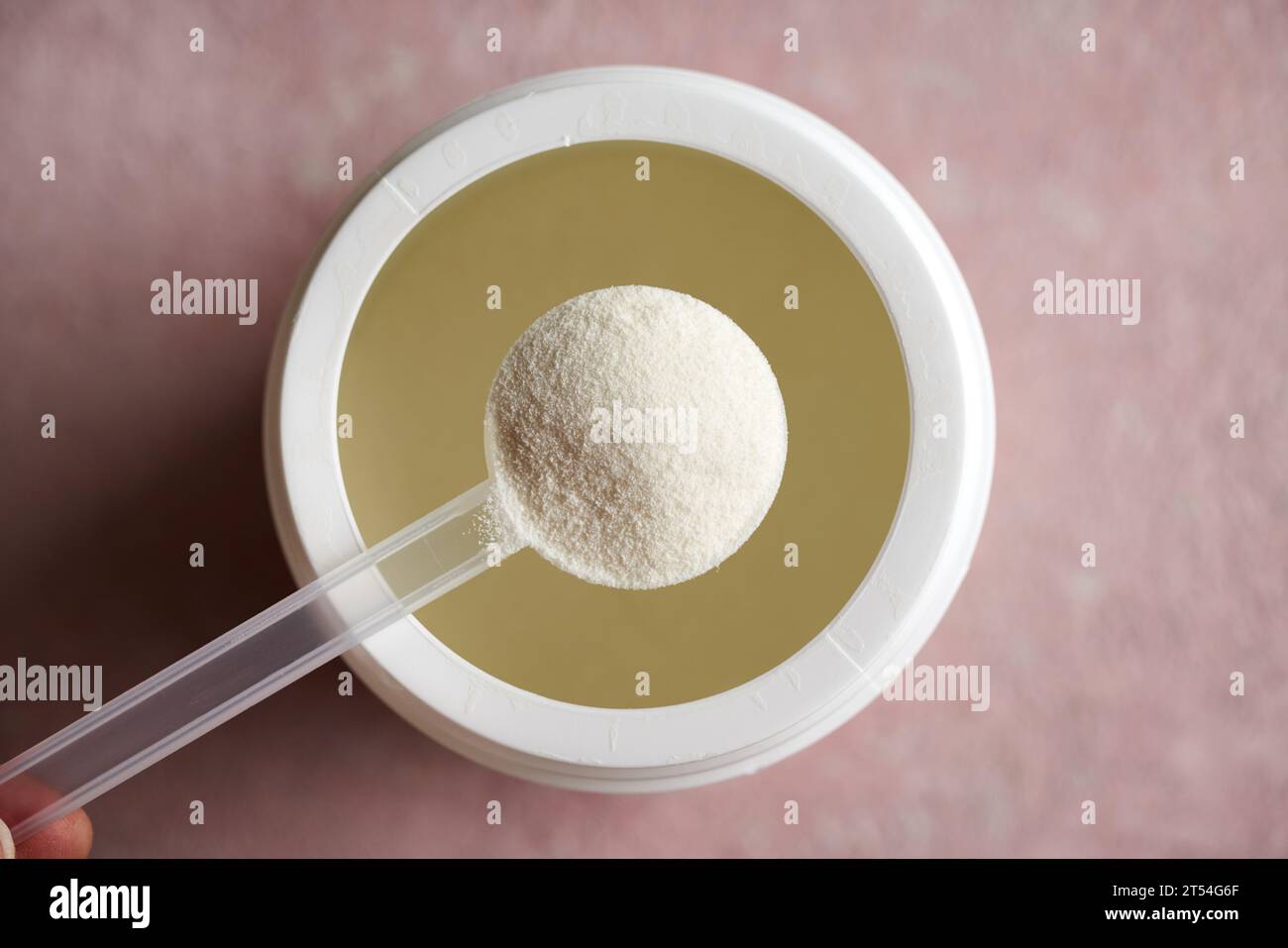 Scooping collagen powder from a jar, top view Stock Photo - Alamy