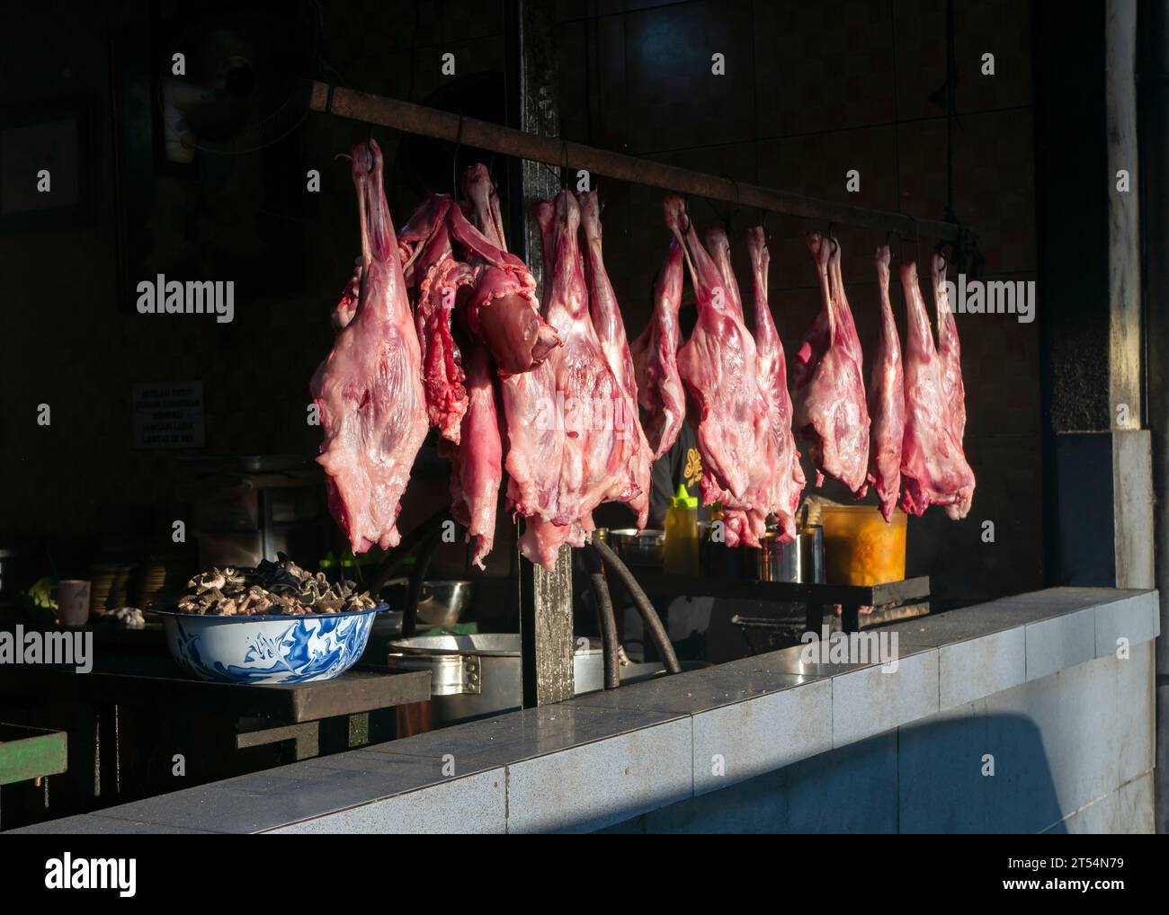 Goat meat hanging on a Goat Satay restaurant (Warung Sate Kambing), in ...