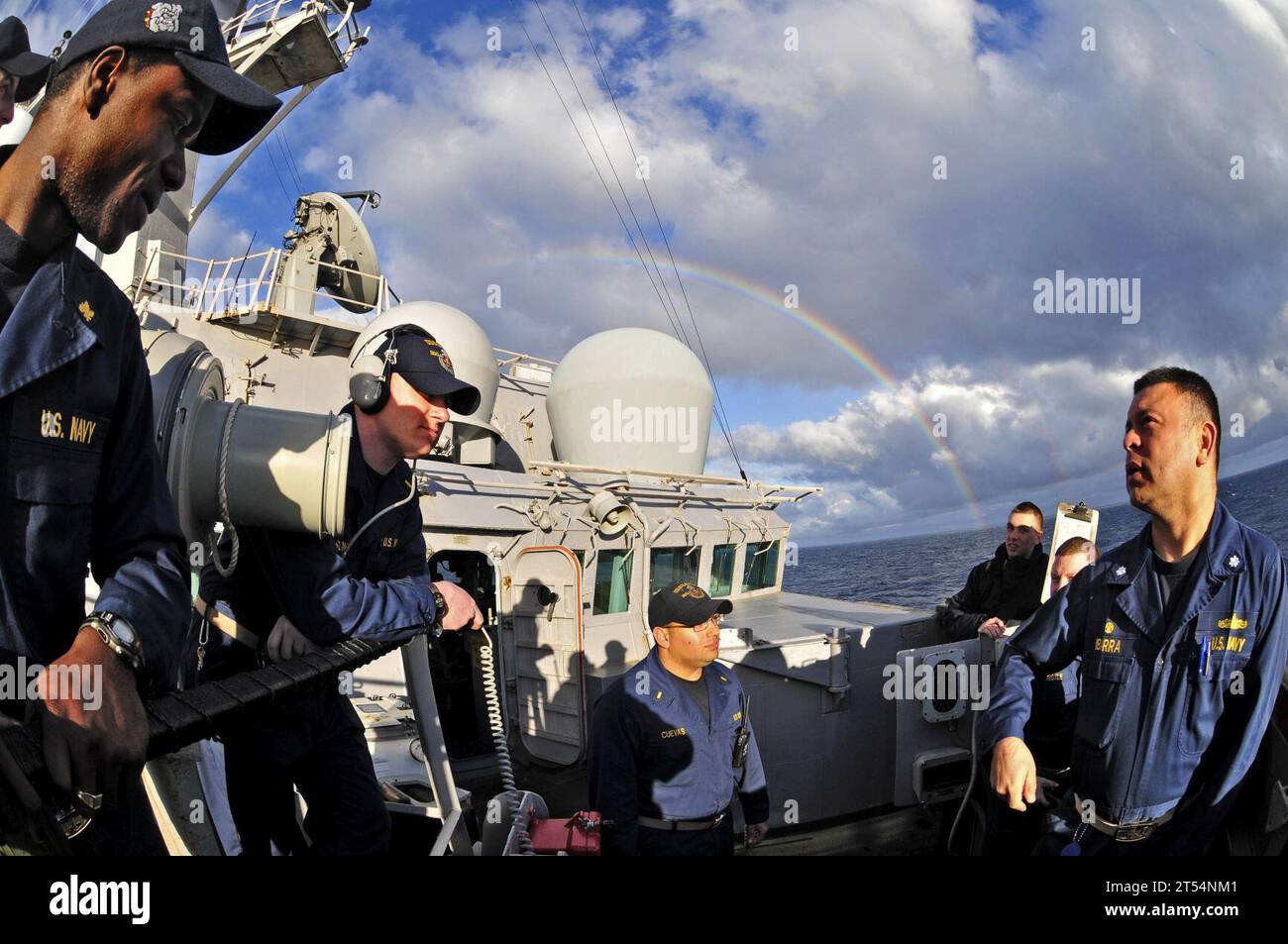 discusses tactics and proper procedures with crew members during a ...