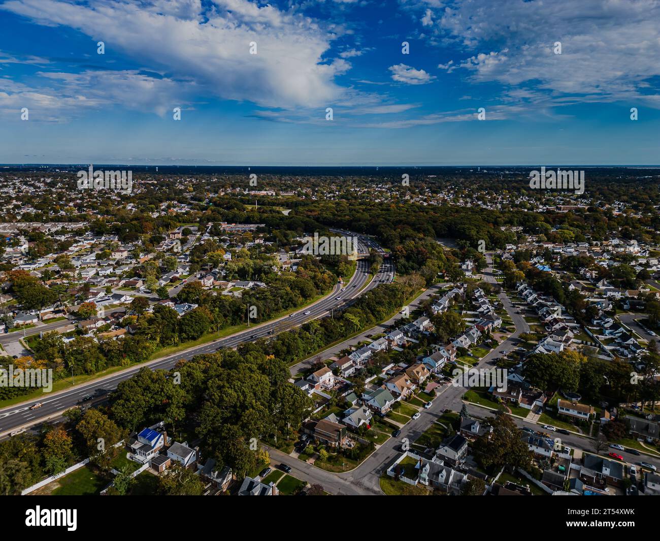 Aerial view of a small town surrounded by lush green countryside ...