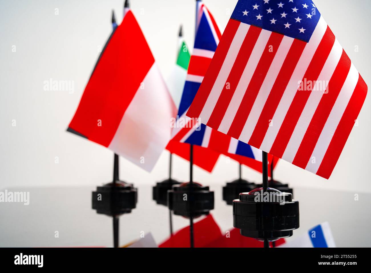 Lots of small national flags on table Stock Photo - Alamy
