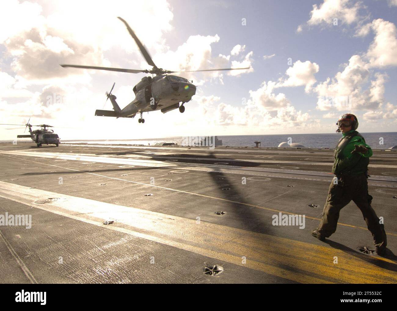 flight deck, green shirt, helicopter, landing Stock Photo - Alamy