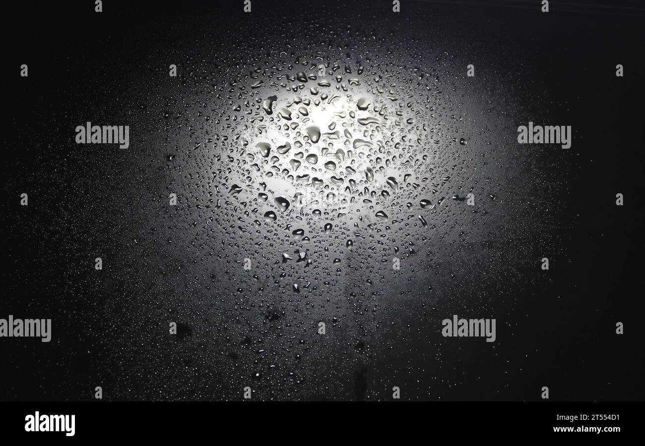 Splashes And Drops Of Liquid Are Sprayed On A Black Surface With Square ...