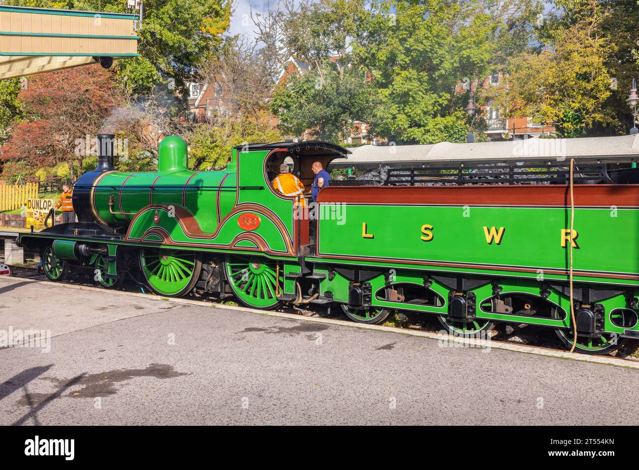 Green steam locomotive at railway station. Swanage, Dorset, England ...