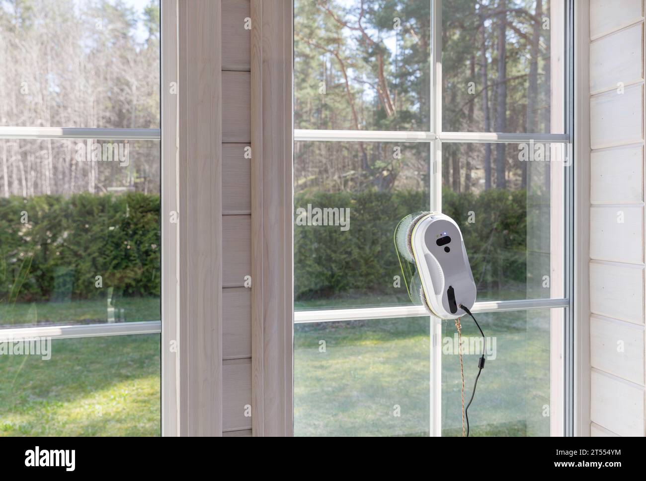 Window cleaning robot. Washing glass using technology in a modern home ...