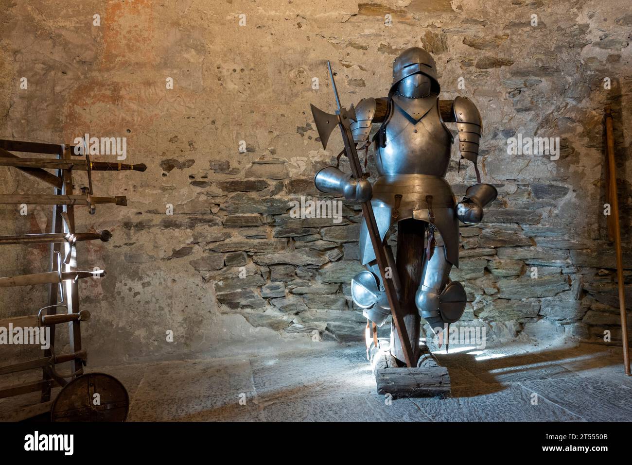 Ancient soldier's armor with sword and halberd. Middle Ages era Stock ...