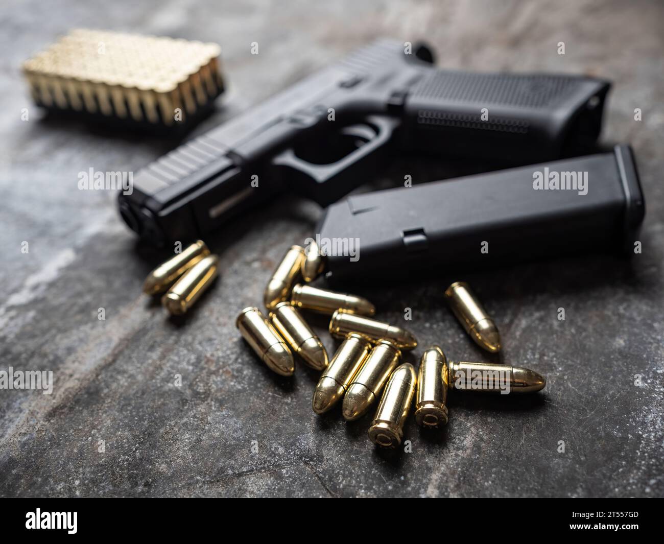Hand gun with ammunition on dark background. 9 mm pistol military ...
