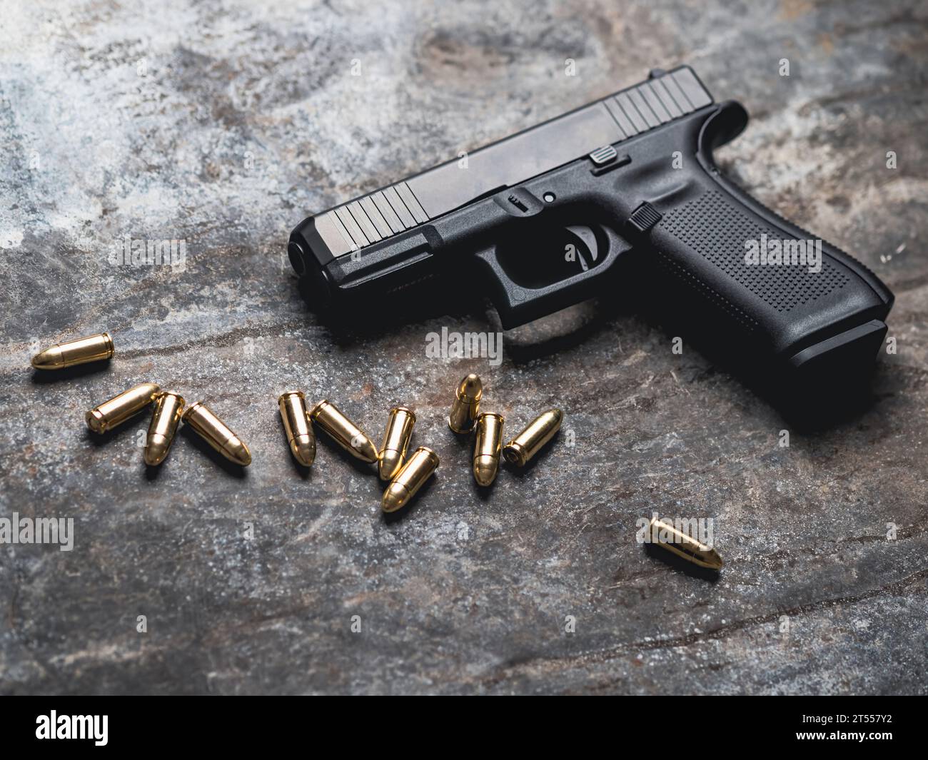 Hand gun with ammunition on dark background. 9 mm pistol military ...