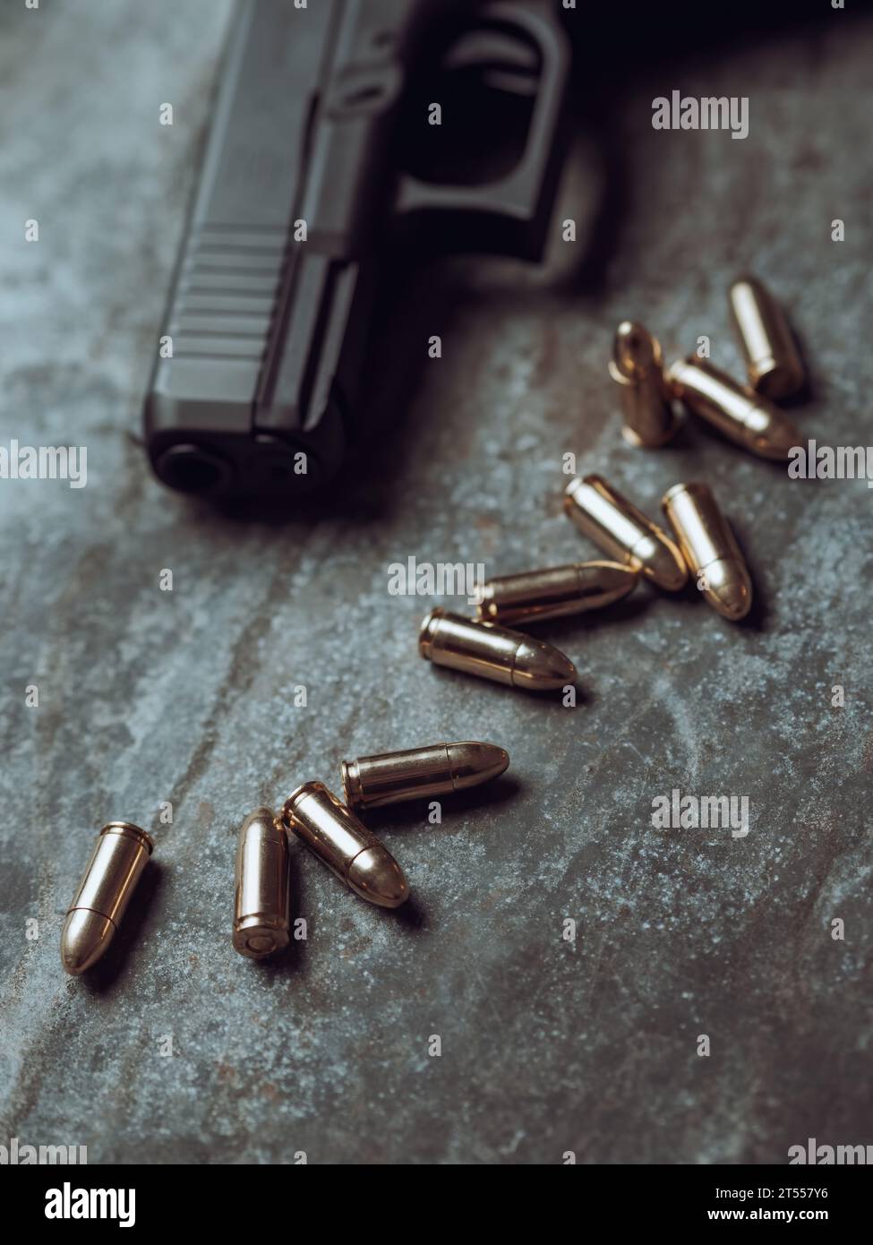 Hand gun with ammunition on dark background. 9 mm pistol military ...