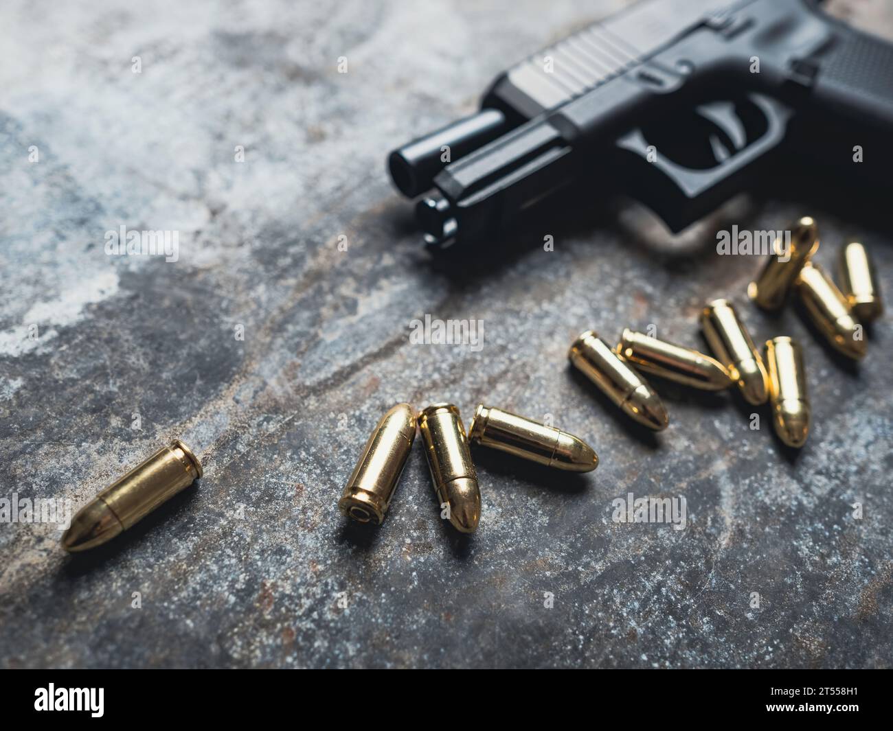 Hand gun with ammunition on dark background. 9 mm pistol military ...