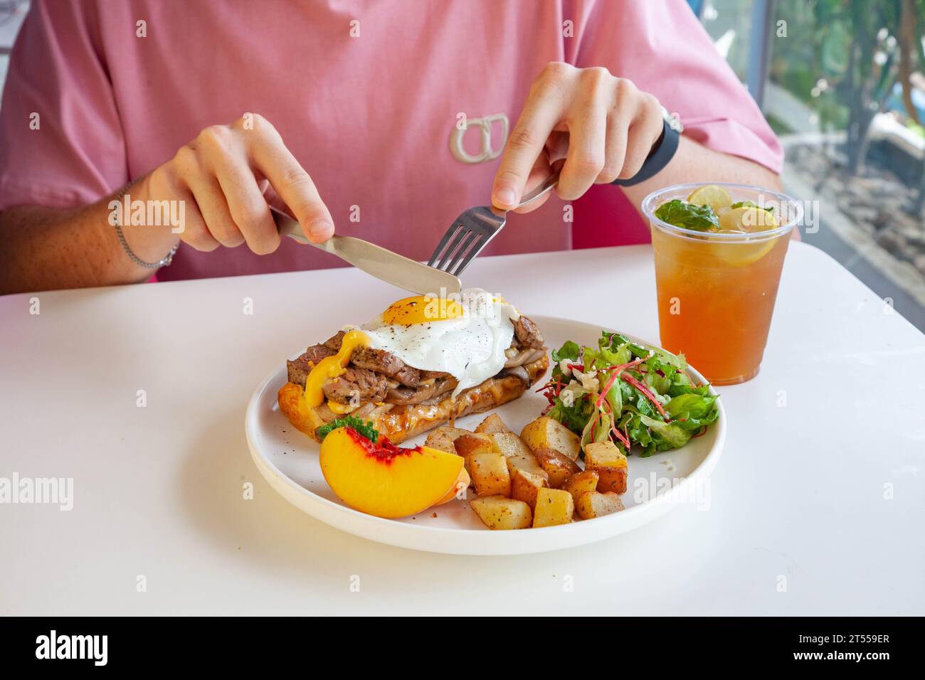 Breakfast egg and roast beef open faced sandwich served at a cafe ...