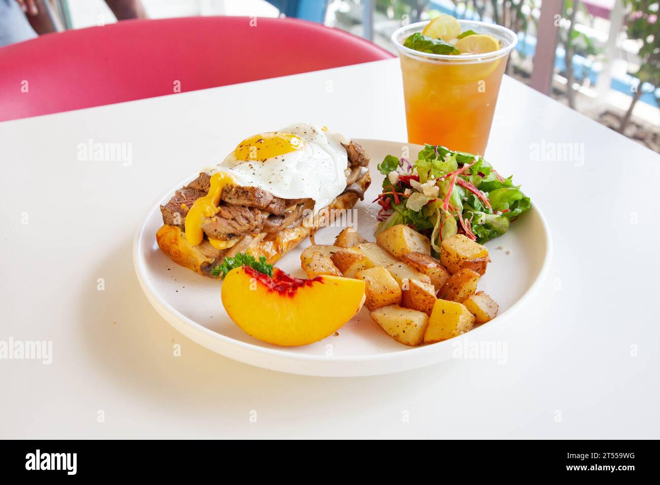 Breakfast egg and roast beef open faced sandwich served at a cafe ...