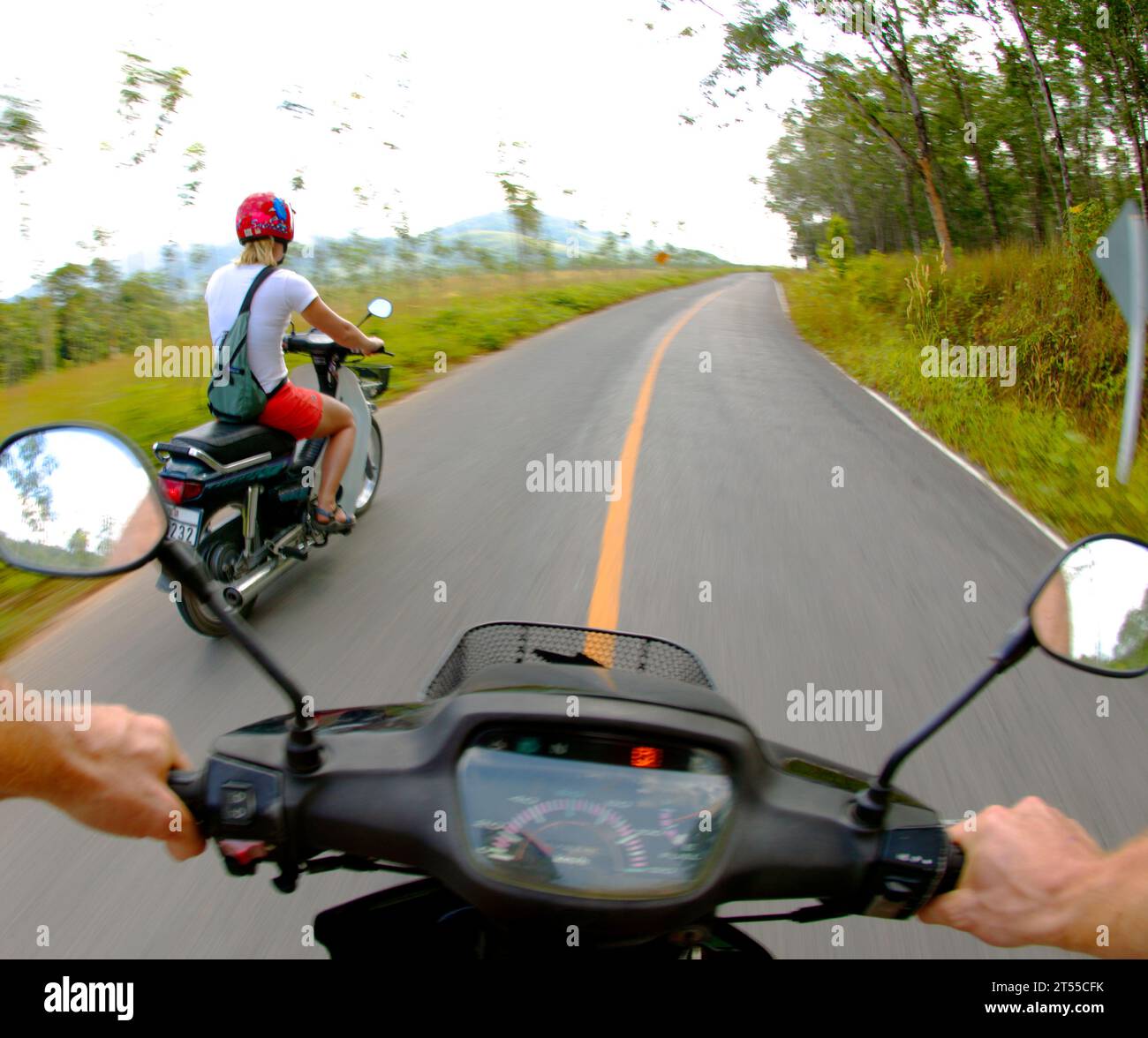 Couples riding scooters hi-res stock photography and images - Alamy