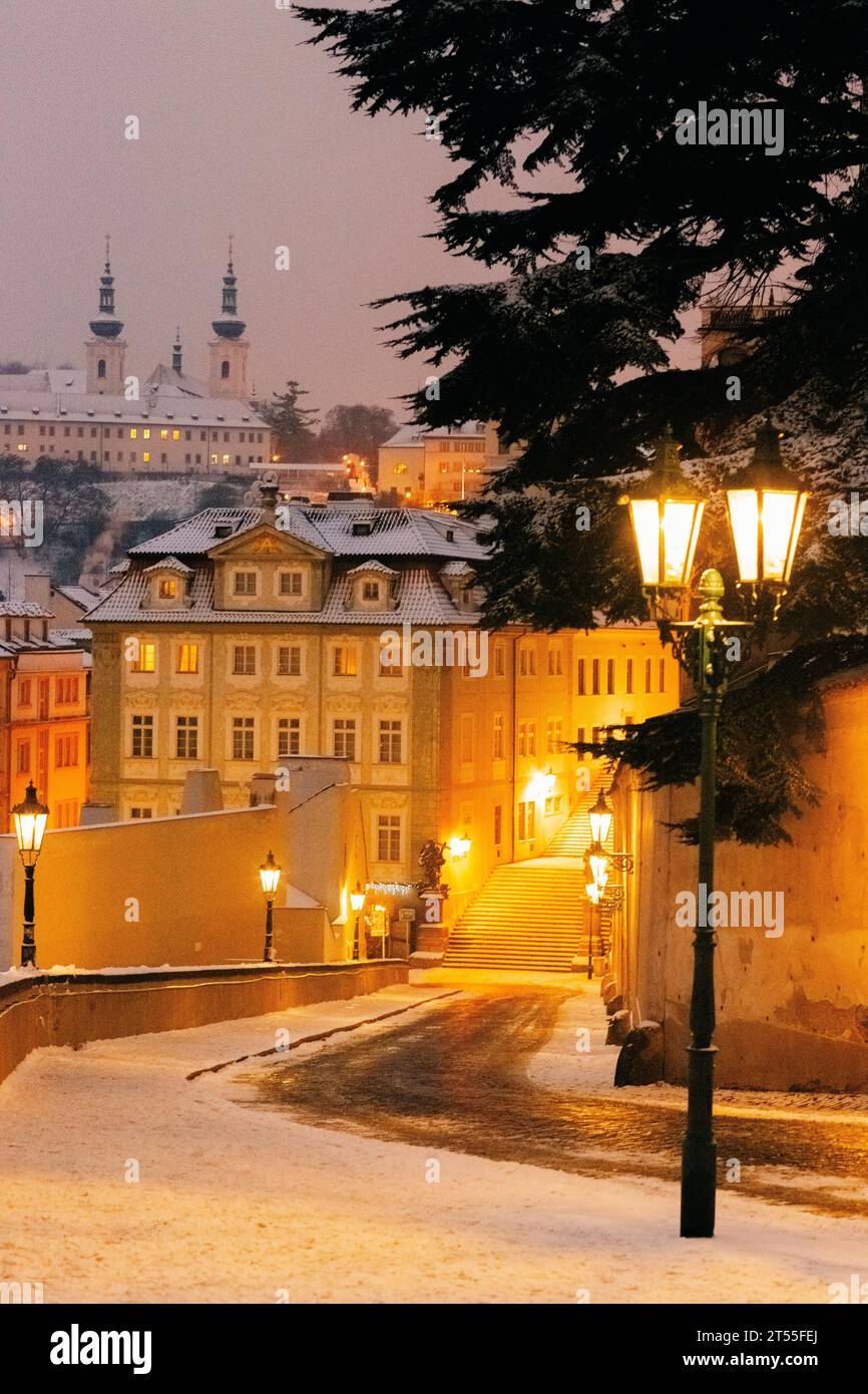 Winter twilight in Prague, snow, no one, lights on, city center Stock ...