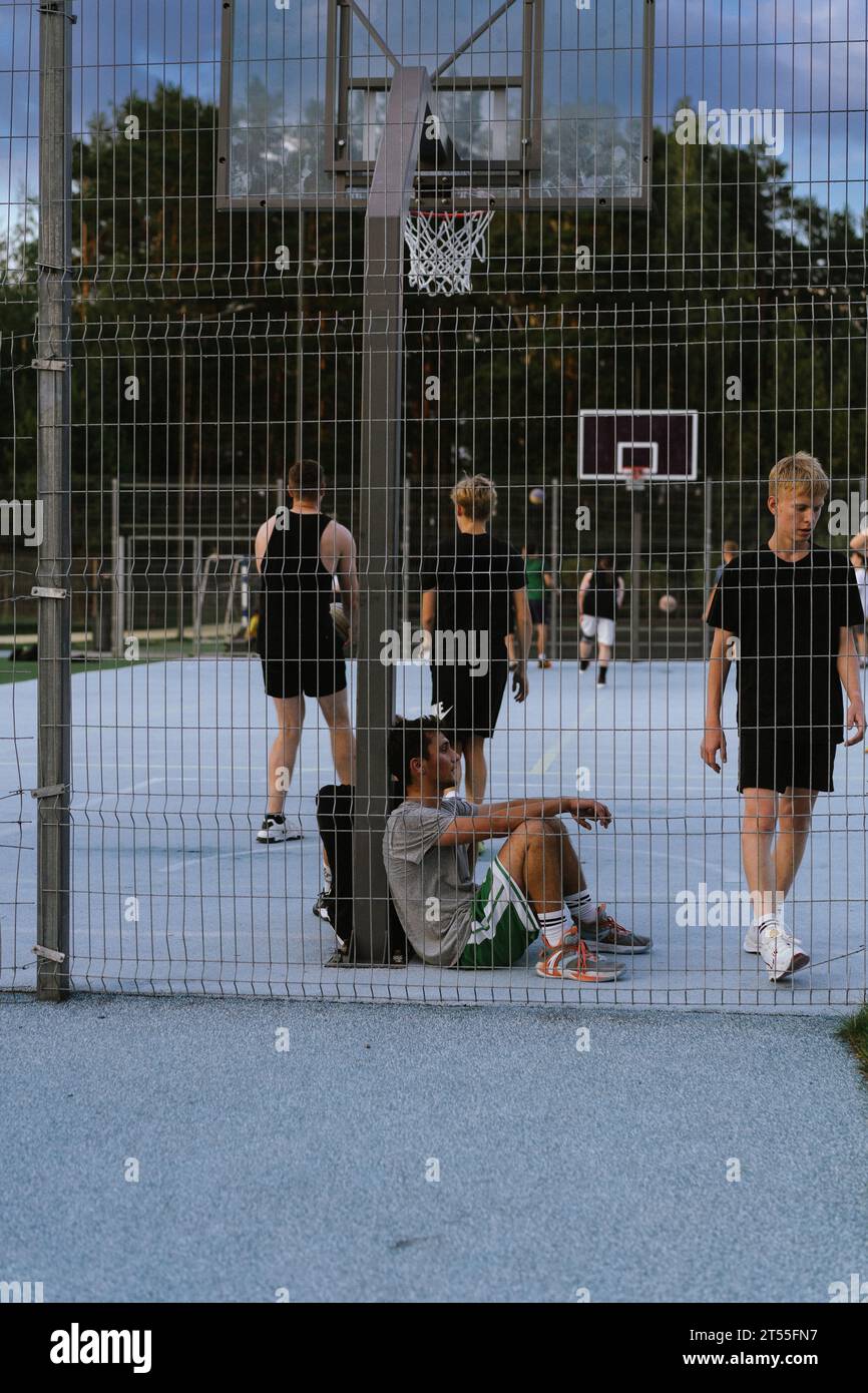 Men play basketball on an open court Stock Photo - Alamy