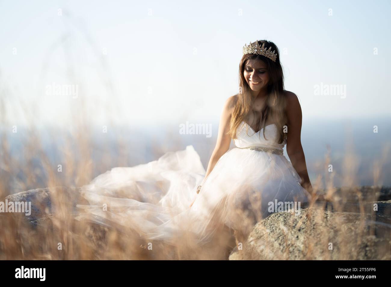Rock Climbing wedding Bride at Sunrise Stock Photo - Alamy