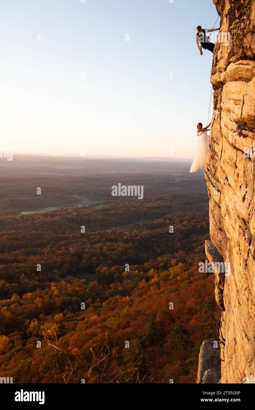 Rock Climbing wedding Bride and Groom at Sunrise Stock Photo - Alamy