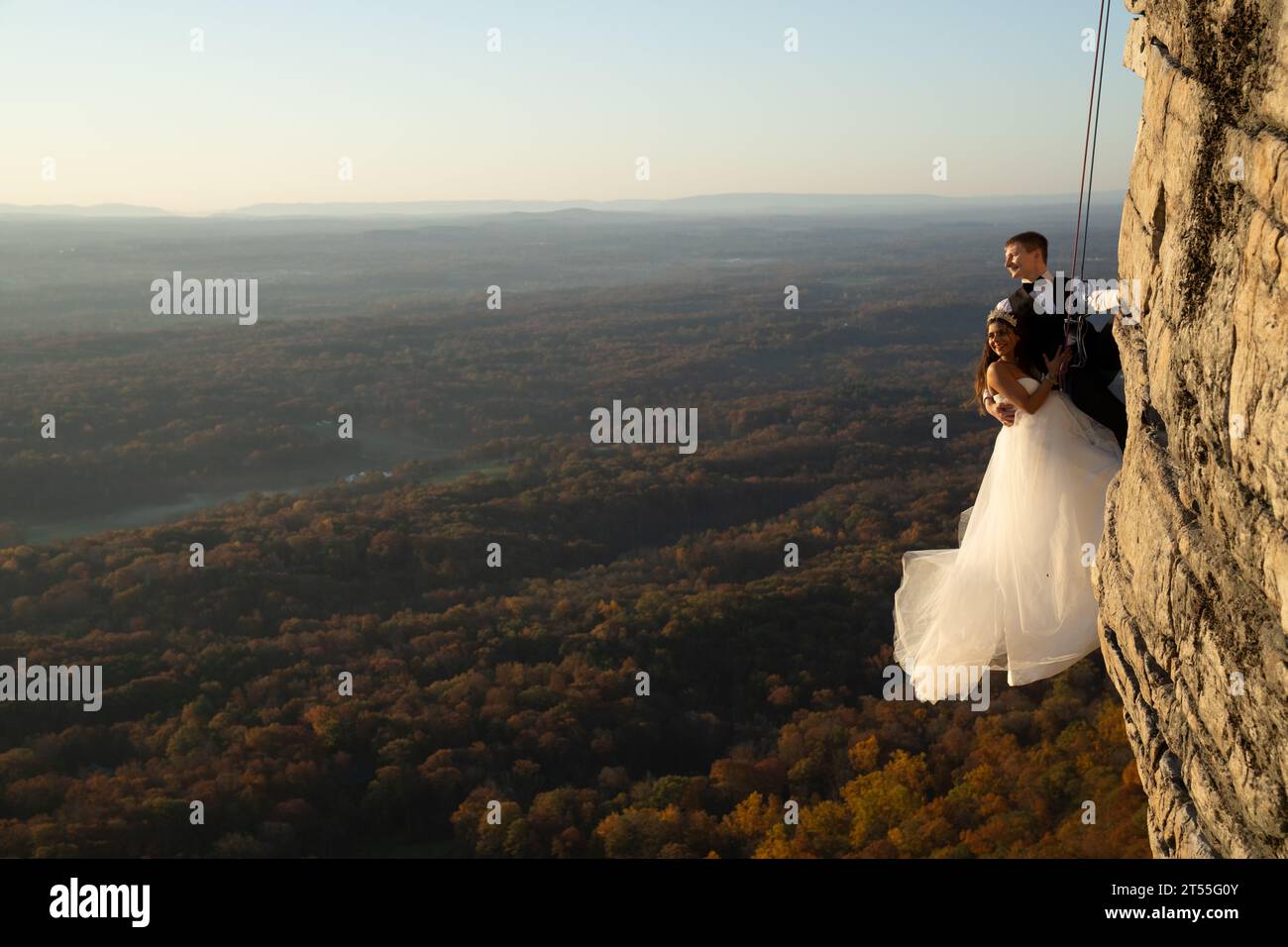 Rock Climbing wedding Bride and Groom at Sunrise Stock Photo - Alamy