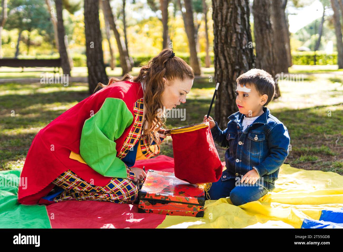 children's entertainer doing a magic trick to a child Stock Photo - Alamy