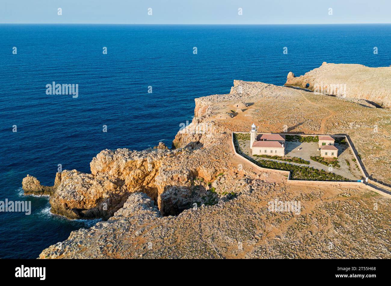 Aerial view of Punta Nati Lighthouse at north coast of Menorca ...