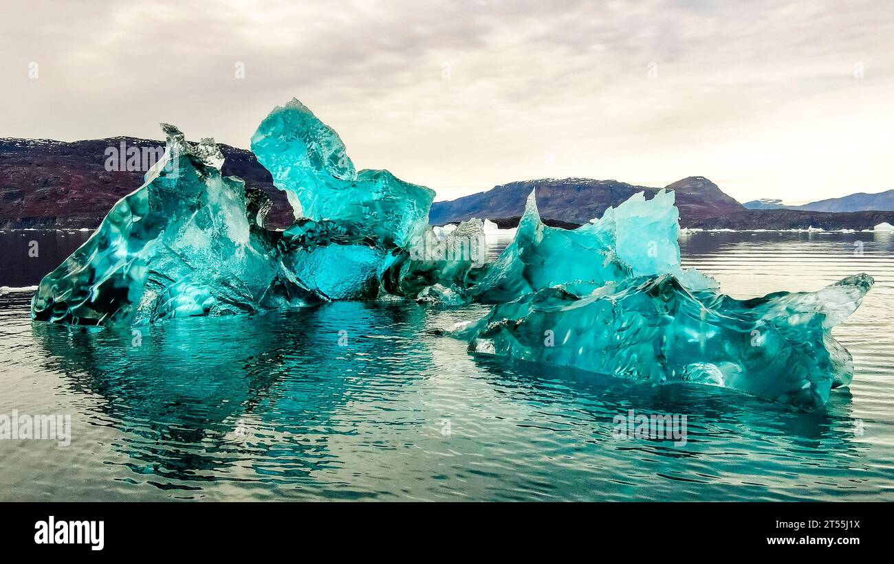 Turquoise iceberg in Scoresby Sound, Greenland Stock Photo - Alamy