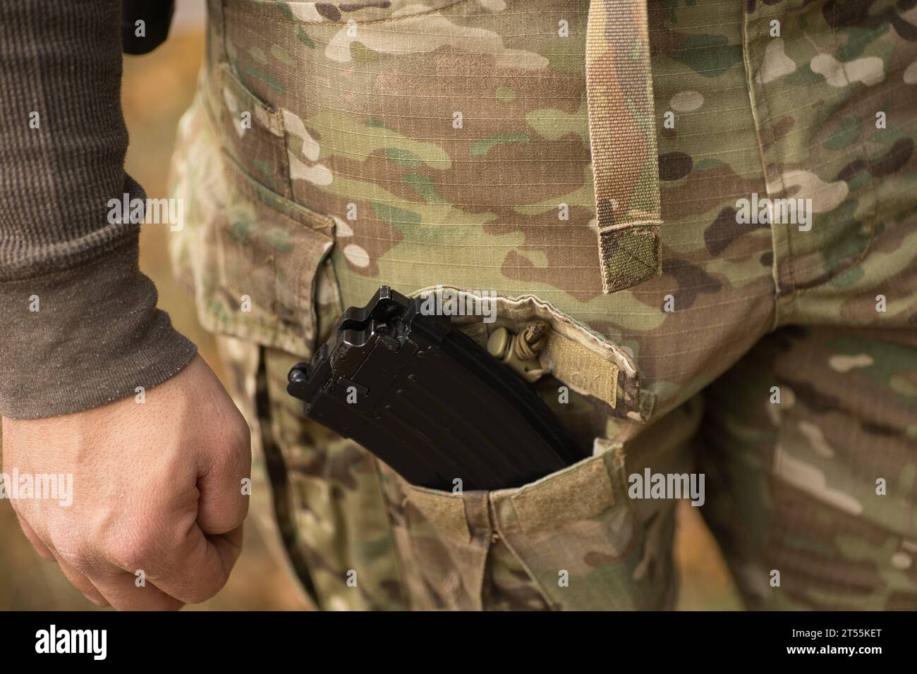 magazine from airsoft ak, in multicam pants pocket Stock Photo - Alamy