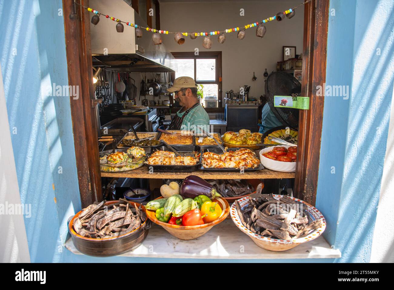 Dishes with food as they appear while passing in a narrow alley of ...