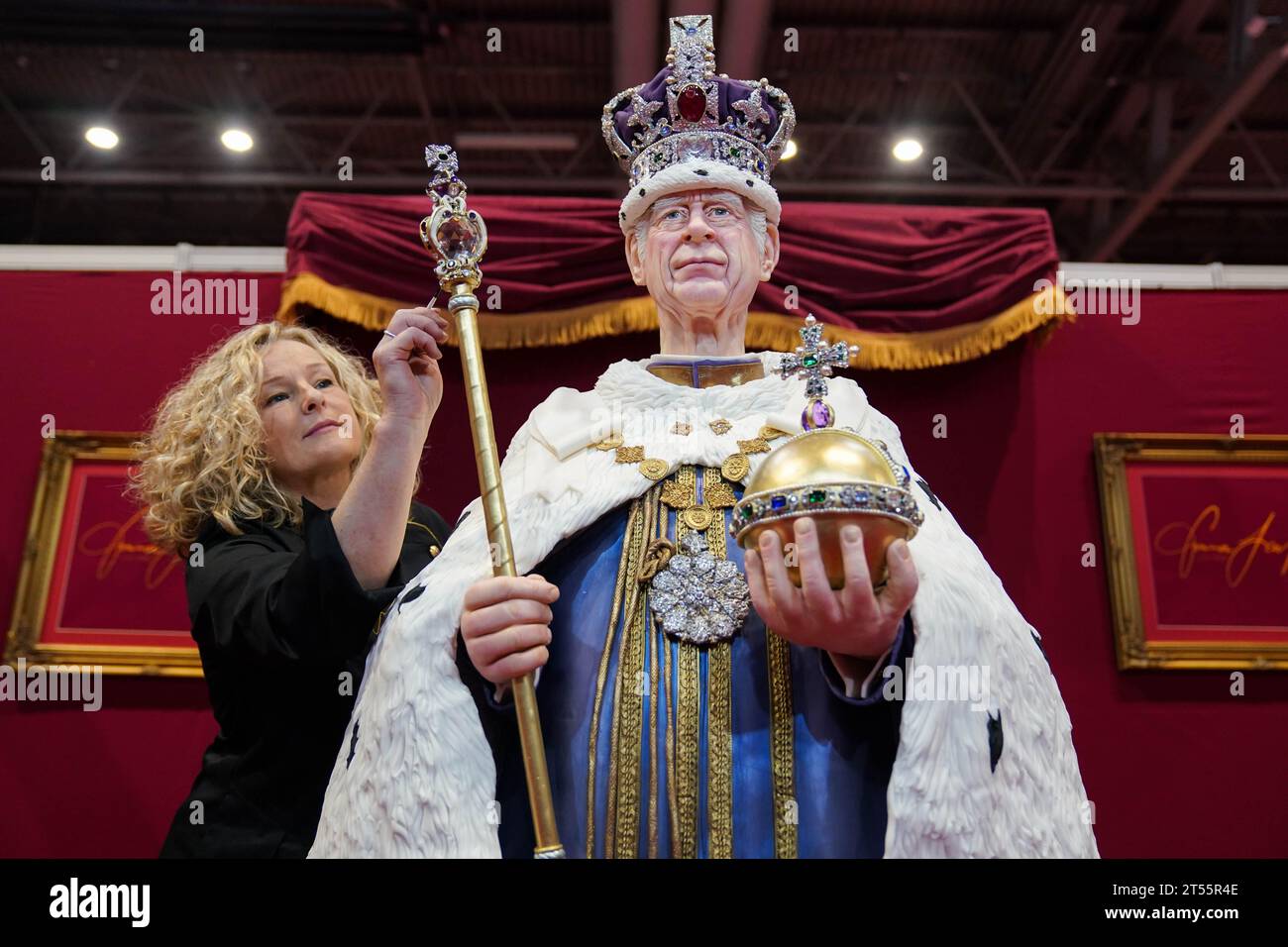 The finishing touches are applied to a lifesize cake figure of King ...