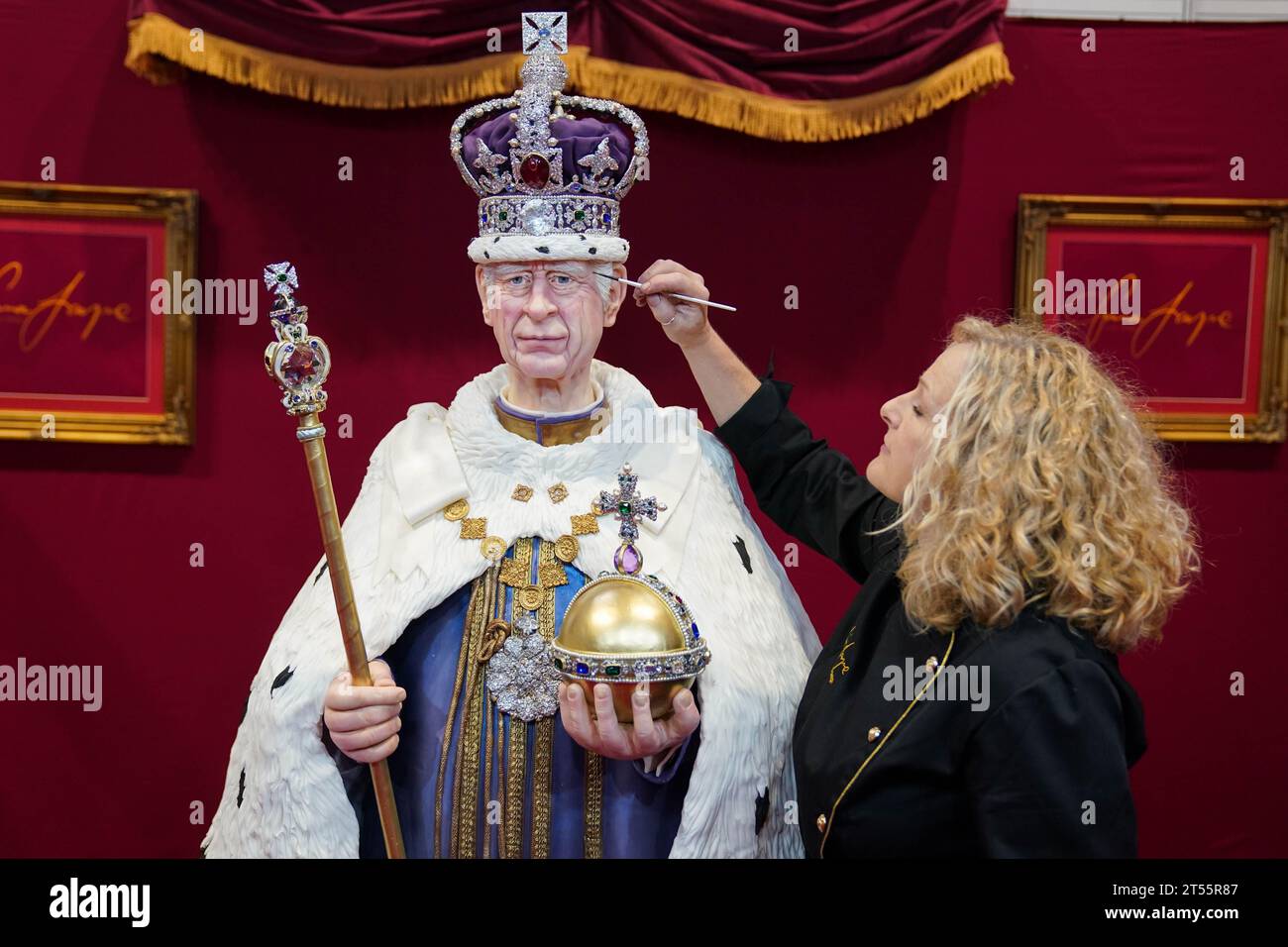 The finishing touches are applied to a lifesize cake figure of King ...
